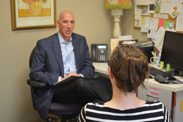 Financial advisor serves hundreds as “money coach”